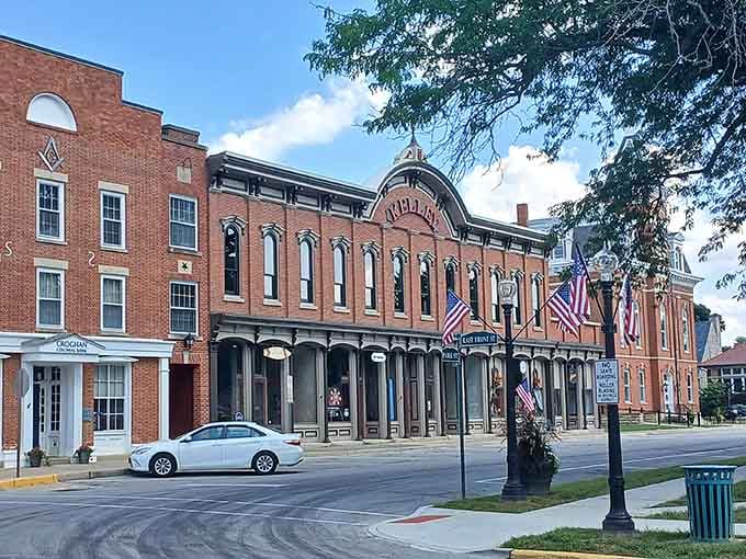 Patriotic flags and pristine brick create a downtown that honors both past and present with equal grace.