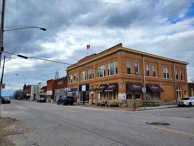 That corner building stands proud like it's been anchoring this community since your grandparents were courting downtown.