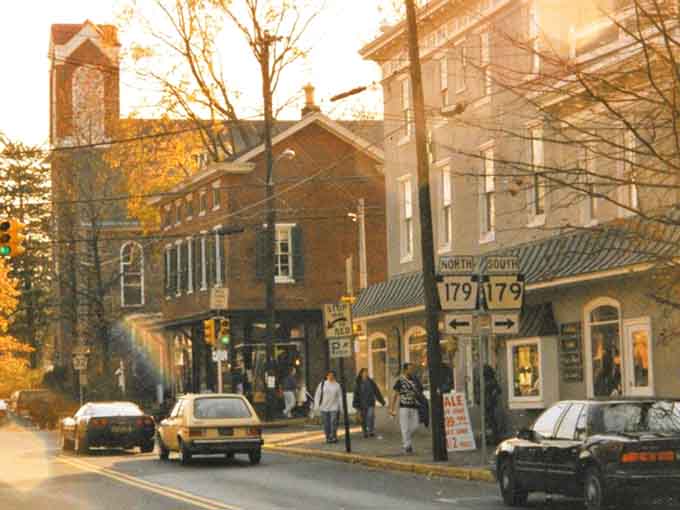 Golden afternoon light bathes these vintage storefronts in warmth that no Instagram filter could ever replicate properly.