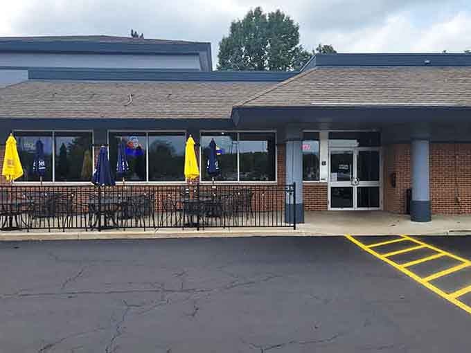 Bright yellow umbrellas dot the patio, inviting you to enjoy lakeside-quality seafood in this welcoming neighborhood spot.