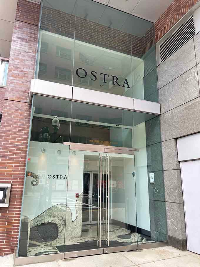 The sophisticated entrance hints at the culinary artistry waiting inside, where ocean meets elegance in every stunning dish.