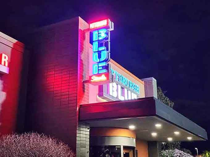 That vibrant neon sign practically sizzles against the twilight, calling steak lovers from miles around the neighborhood.