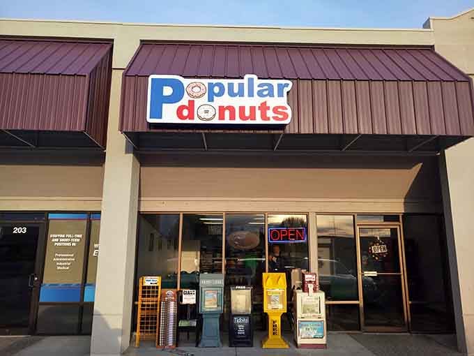 Bright blue skies frame this beloved spot where the promise of fresh donuts makes every morning feel special.