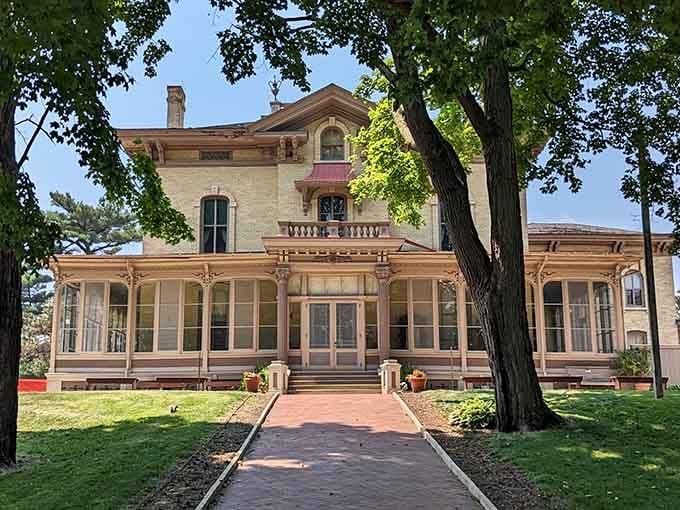 Victorian splendor meets prairie practicality in this mansion where wraparound porches promise lazy afternoons and lemonade conversations.