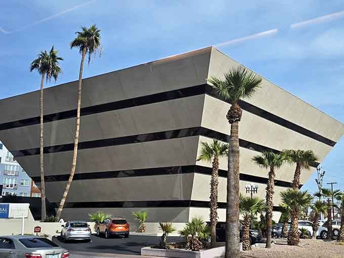 Palm trees flanking the dark pyramid create a scene that's part Miami Vice, part ancient wonder, all Phoenix.