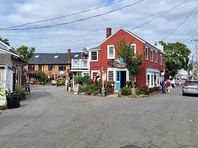 Red clapboard charm meets seaside character where locals stroll past shops that've weathered countless New England storms beautifully.