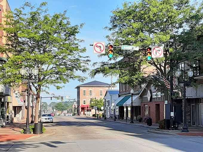 Morning light hits this tree-lined street where neighbors gather and your budget finally gets to breathe a little.