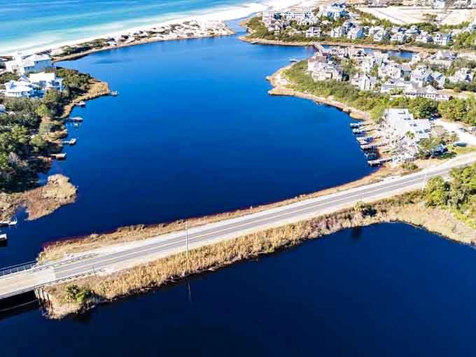 Coastal dune lakes shimmer an impossible shade of blue, nestled between road and beach like hidden sapphires waiting to be discovered.