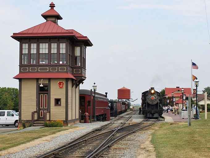 The vintage railroad tower stands proud beside gleaming tracks, ready to transport you back to steam engine glory days.