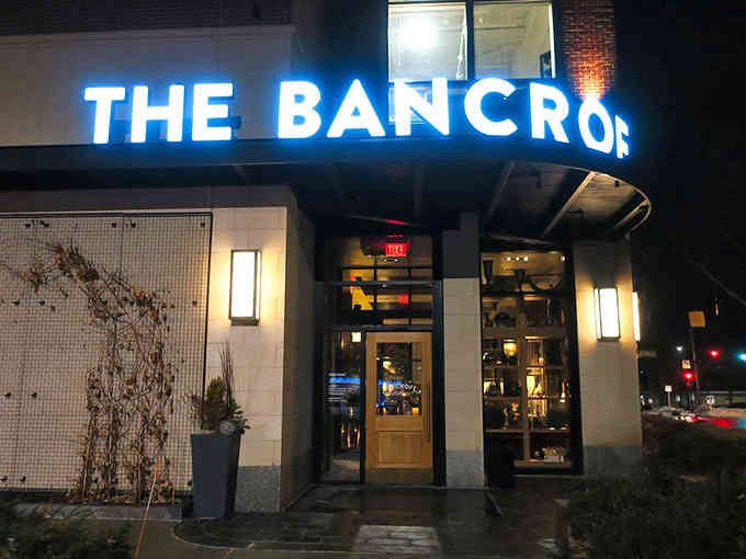 Evening lights transform this sleek exterior into a beacon for serious carnivores seeking elevated dining experiences.
