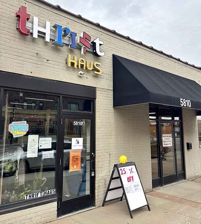 The modern storefront with that cheerful "OPEN" sign welcomes you to discover curated vintage pieces at wallet-friendly prices.