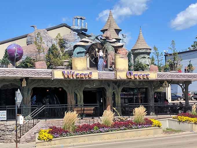 Colorful flower beds frame the whimsical entrance to this multi-level adventure where puzzles and magic await discovery.