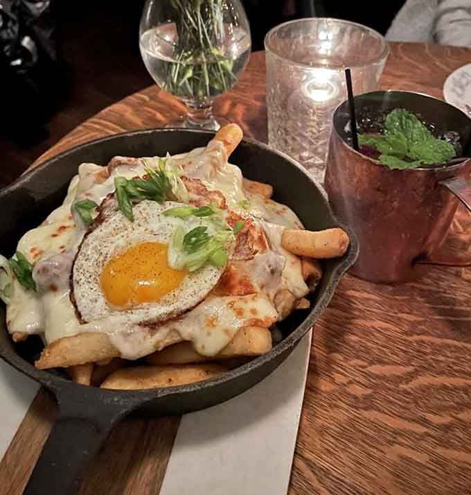 Poutine topped with a sunny-side egg is basically breakfast meeting dinner for the world's best collaboration.