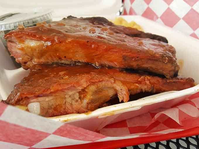 These glistening ribs wear their sauce like a badge of honor, ready for their close-up.