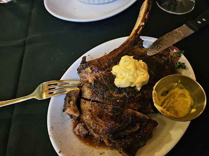 The tomahawk ribeye arrives like a prehistoric feast, complete with bone marrow butter and serious bragging rights.