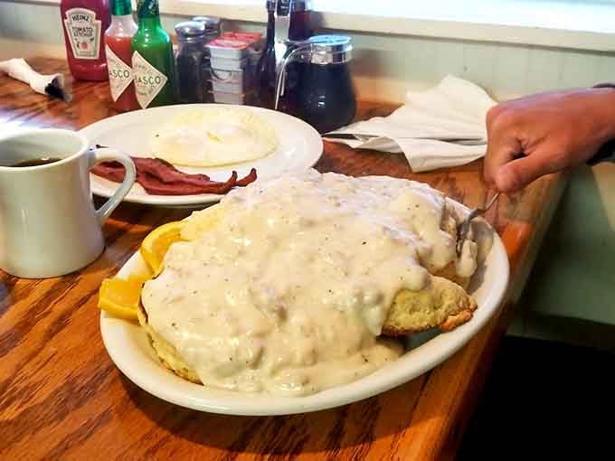 Biscuits and gravy so generous it looks like a fluffy cloud decided to become breakfast.