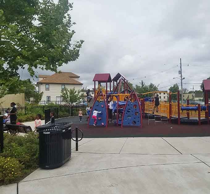 Bright playground equipment promises afternoon adventures for kids while parents remember their own carefree summer days gone by.