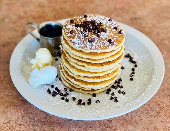 Chocolate chips scattered across golden pancakes like edible confetti celebrating your excellent decision-making skills this morning.