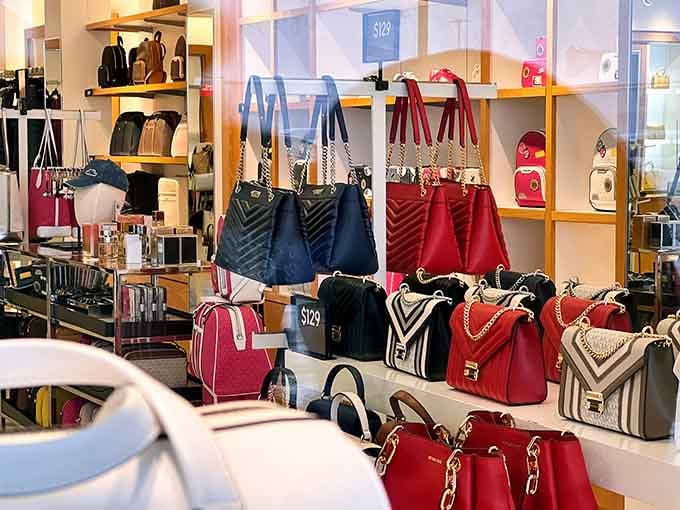 Designer handbags lined up like jewels in a treasure chest, minus the pirate ship and eye patches.