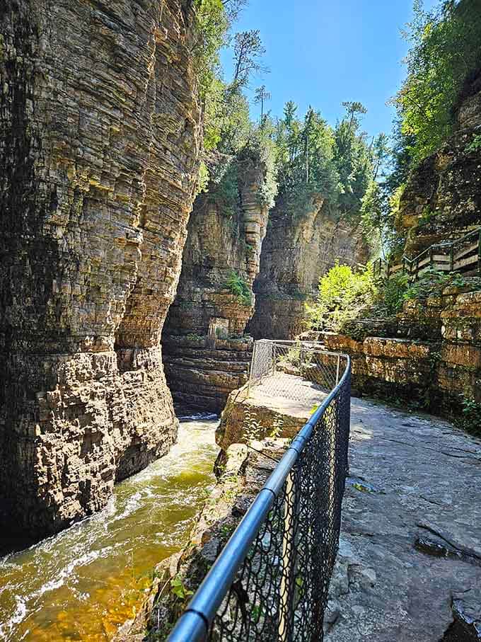 Metal walkways clinging to ancient stone, proving that sometimes the best views require a little faith in engineering.