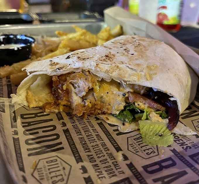 That wrap is bursting with chicken and pimento cheese, proving Southern comfort food works beautifully in portable form too.