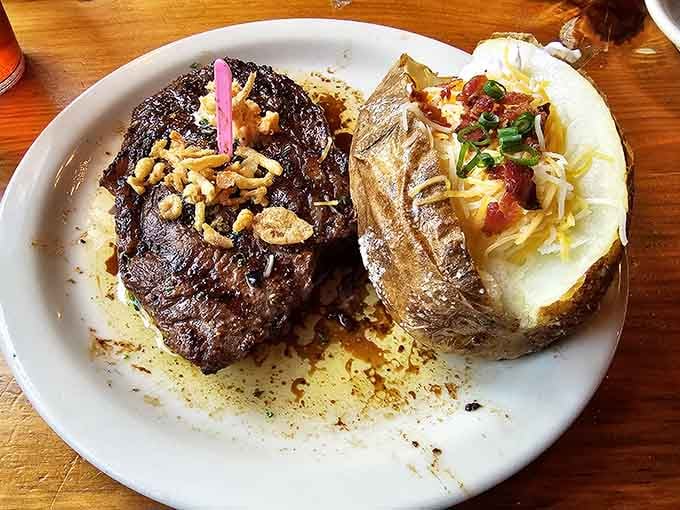 That perfectly seared ribeye paired with a loaded baked potato is basically the definition of comfort food excellence.