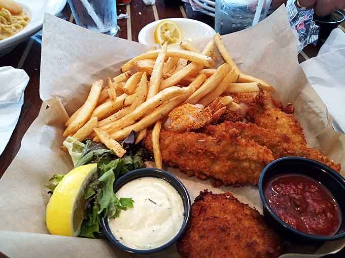 Two generous pieces of battered fish alongside fries that know their job is supporting actor, not the star of this show.