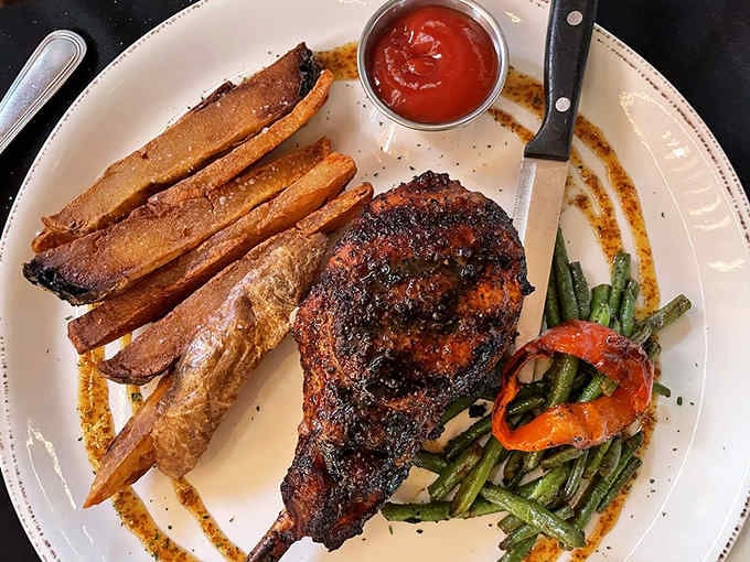 When your pork chop arrives with its own entourage of roasted vegetables, you know you're in good hands.