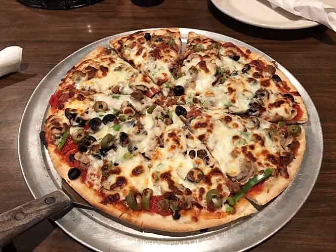 This Supreme pizza wears its toppings like badges of honor, each ingredient fighting for your attention and winning.