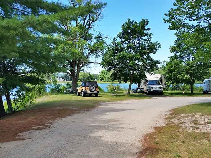 Lakeside camping where your biggest decision is which tree provides the best shade for your afternoon nap.