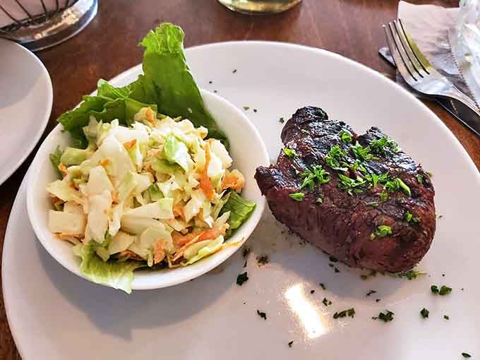 The Filet Mignon arrives tender enough to cut with a whisper, paired with coleslaw that's refreshingly old-school.