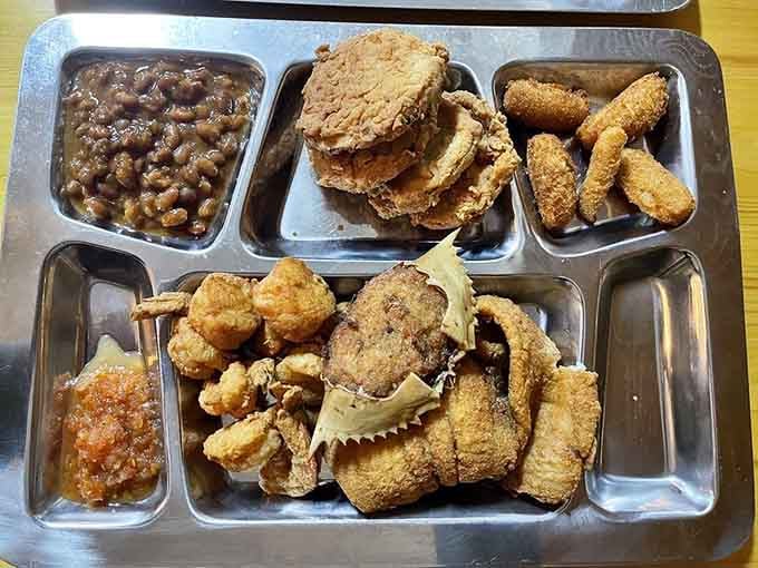 Golden fried seafood piled high on a tray proves that sometimes excess is exactly what the doctor ordered.