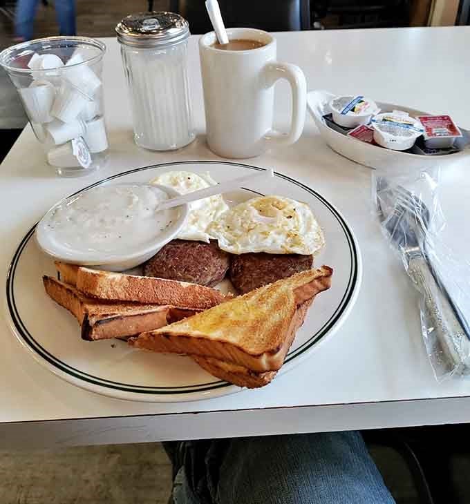 This breakfast plate with eggs, sausage, and toast proves mornings at Brown Bag Chicken are worth setting an alarm for.