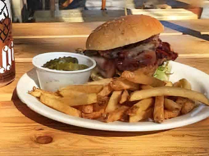 The Texas Swiss Bacon Burger arrives loaded and ready to challenge your jaw's structural integrity in the best way.