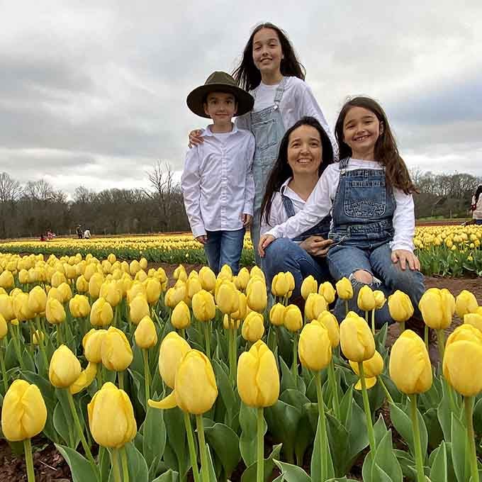 Nothing says family bonding quite like sitting in a sea of yellow tulips and actually enjoying each other's company.