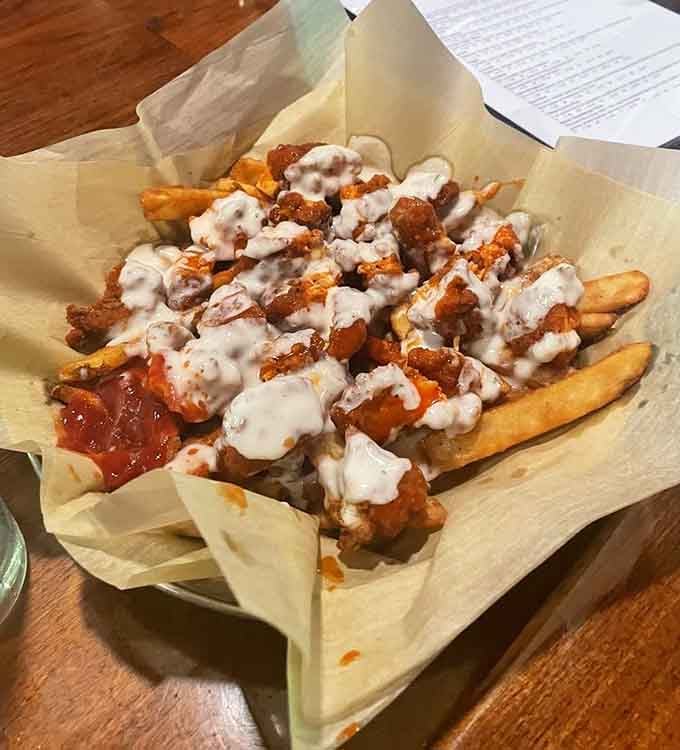 Buffalo chicken fries drizzled with enough sauce to make your taste buds stand up and salute with joy.