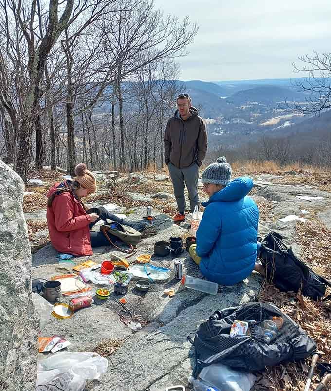 Summit picnics hit different when your dining room overlooks half the state and you've earned every bite.