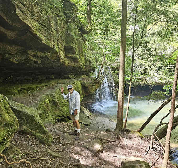 Nothing says "I conquered nature" quite like that triumphant wave beside a stunning waterfall.