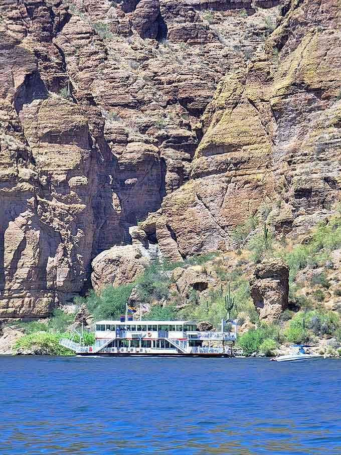 The Dolly Steamboat nestled against layered canyon walls looks like a postcard that shouldn't exist but gloriously does.