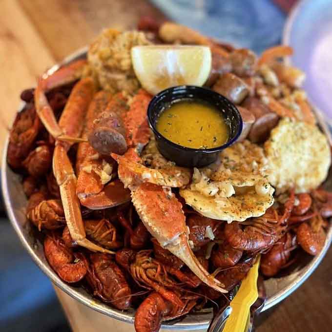 This glorious bucket of crawfish, crab, and shrimp proves that sometimes the best meals require bibs and butter.
