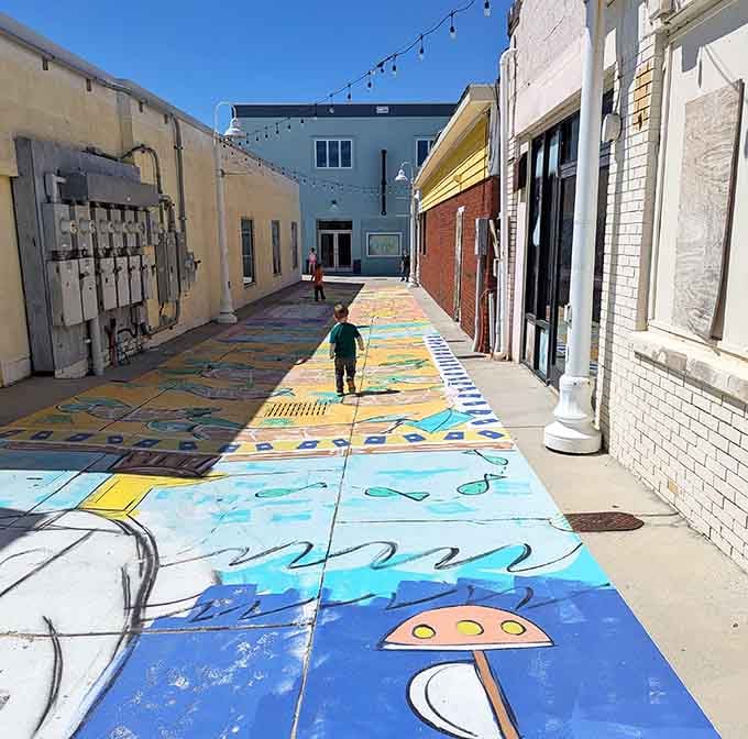 Hand-painted sidewalks turn a simple stroll into an adventure, delighting kids who've never seen pavement this playful before.