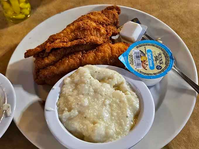 Golden fried catfish meets creamy grits in a Southern comfort food love story for the ages.