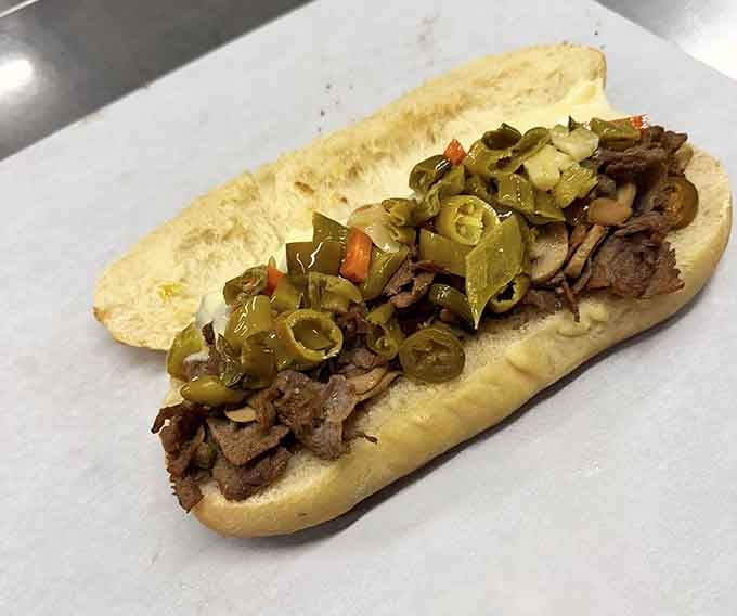 Tender beef and peppers nestled in a perfectly toasted hoagie roll, ready to make your lunch break legendary.