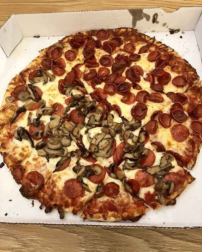 Half pepperoni, half mushroom proves that compromise can be absolutely delicious when pizza is involved at Cheshire Market.