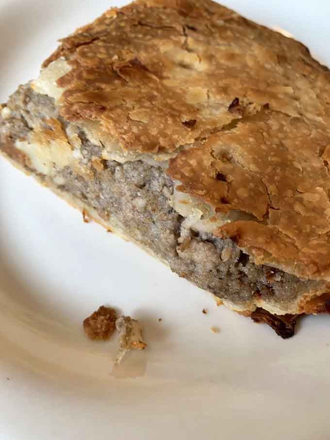 Flaky pastry crust concealing savory meat filling brings a taste of Quebec straight to your Manchester morning.