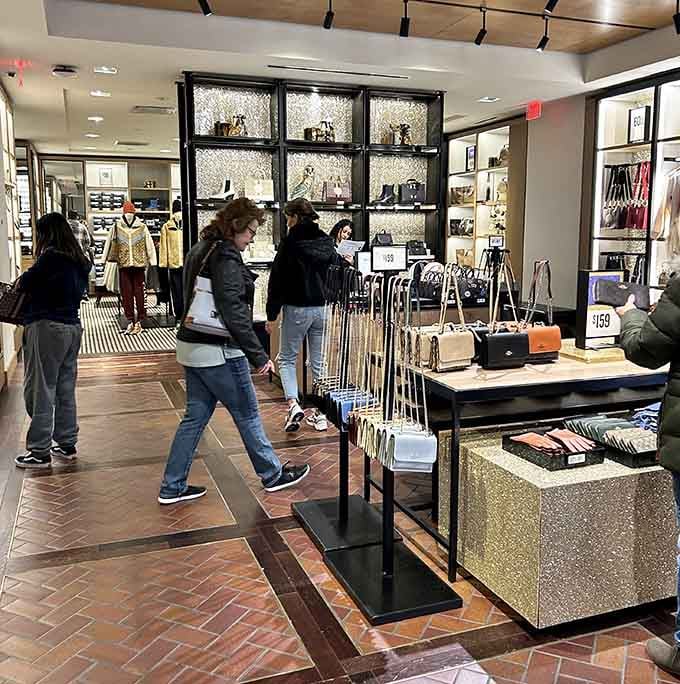 Brick walkways and modern storefronts create a shopping village where your feet do the walking and your wallet does the celebrating.
