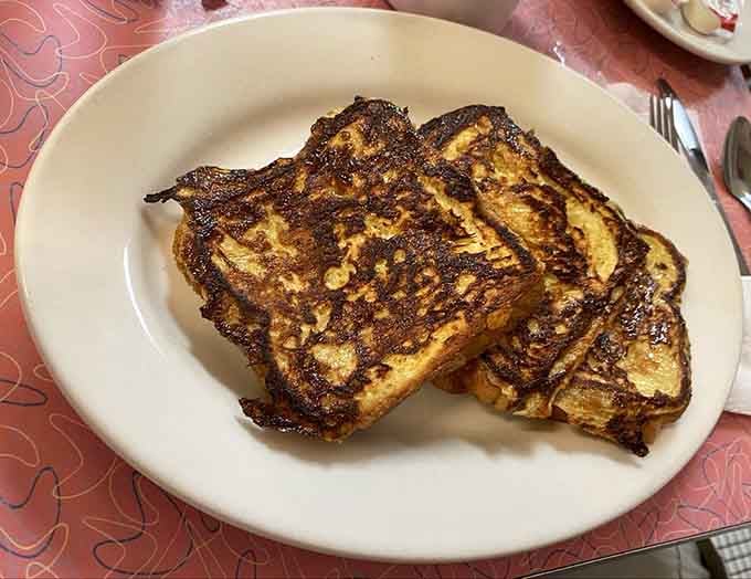 Texas-sized French toast with that perfect golden-brown crust proves everything really is bigger when it needs to be.