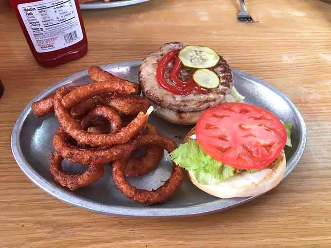 That olive burger paired with golden onion rings proves Michigan knows how to do diner classics absolutely right.