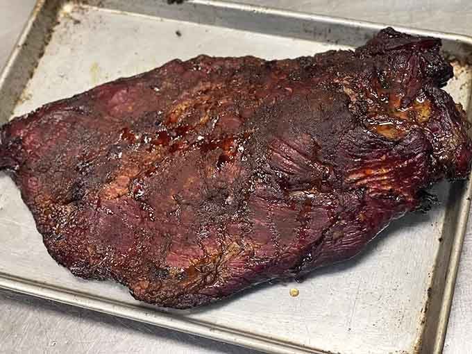 That smoke ring and caramelized bark tell you everything you need to know about patience and pit mastery.