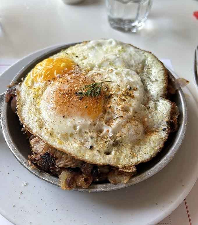 Hash browns never looked this good, and that egg on top is basically wearing a crown.
